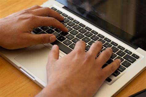 Premium Photo Hands Typing On Laptop Keyboard Closeup Of Hands Typing