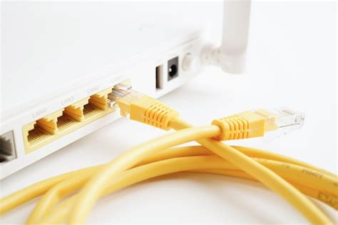 Premium Photo Ethernet Cable With Wireless Router Connect To Internet