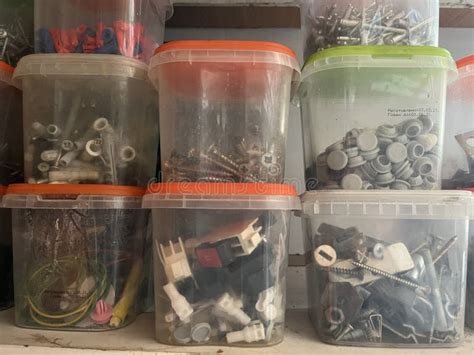 Organizing Assorted Hardware Items In Clear Storage Containers On A