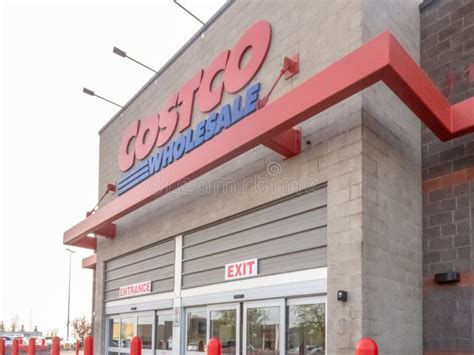 The Entrance Of A Costco Wholesale Store With Its Prominent Red And