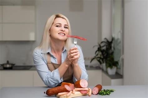 Woman Eating Sausage