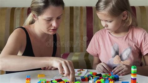 A Mother And Daughter Engage In Imaginative Play With Building Blocks Stock Video Video Of