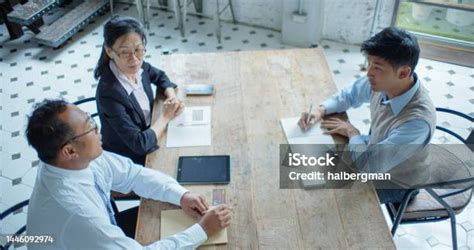 Overhead Shot Of Meeting Or Job Interview In Modern Taipei Office Stock