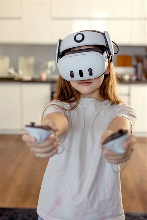 Girl In Vr Glasses Playing A Game At Home Learning And Playing With Augmented Reality Glasses