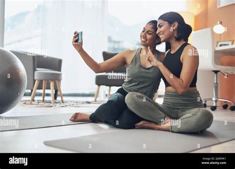 Lets Take A Selfie Before We Workout Two Young Women Taking A Selfie