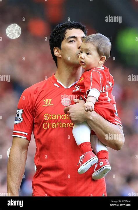 Liverpools Luis Suarez And His Son Benjamin On The Pitch After The