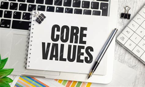 Premium Photo Core Values Text And Notepad With Pen Charts And Calculator
