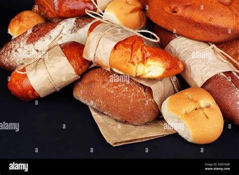 Different Types Of Bread On Black Background Close Up Stock Photo Alamy