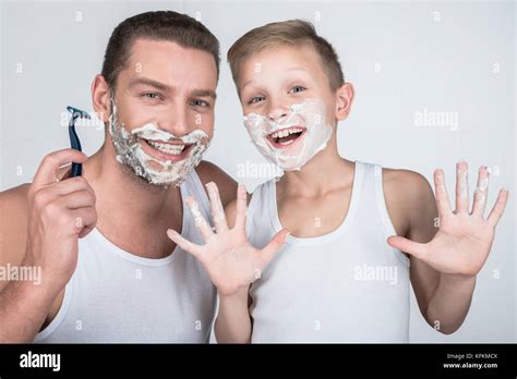 Father And Son Shaving Together Stock Photo Alamy
