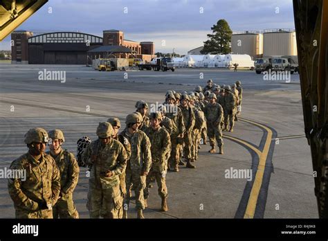 Soldiers From The 541st Sapper Company Prepare To Board An Air Force C