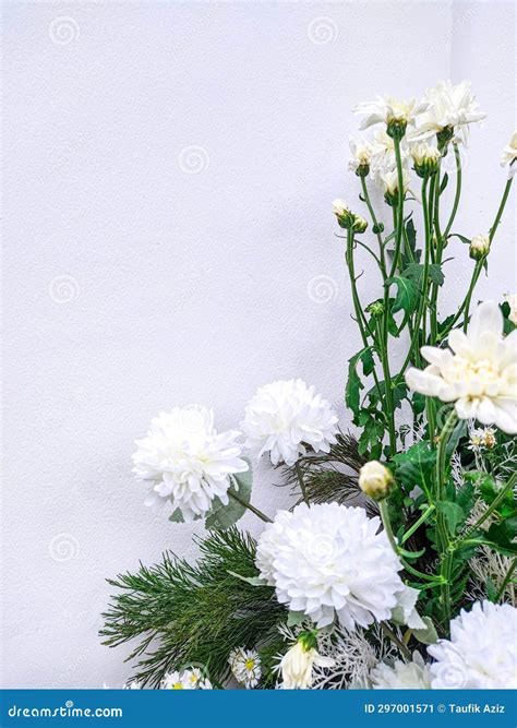 Wooden Background Or White Walls Decorated With White Flowers And Green
