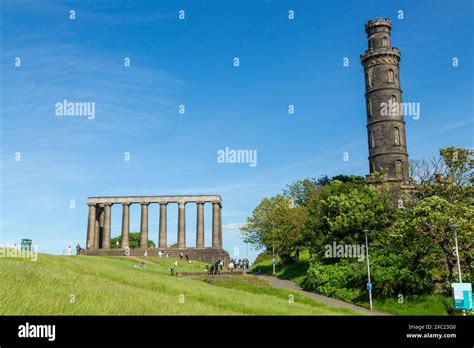 The National Monument Of Scotland And Nelsons Monument Right On
