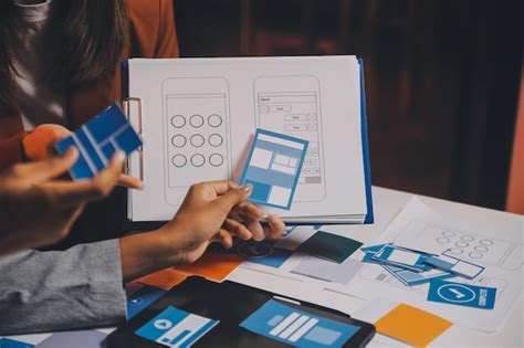 Premium Photo Team Of Ui Ux Web Designer Are Working Together To