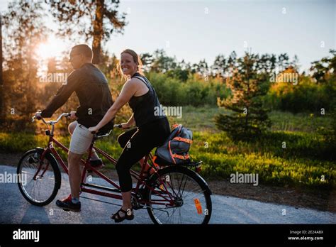Couple Riding Tandem Bike Stock Photo Alamy