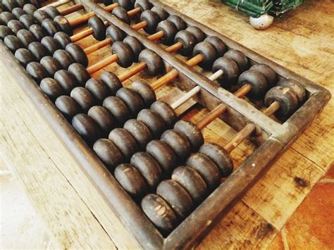 Premium Photo High Angle View Of Abacus On Table