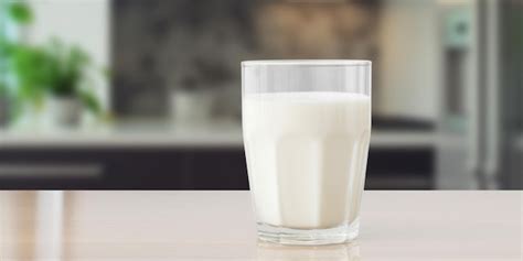 Premium Ai Image A Glass Of Milk On A Table