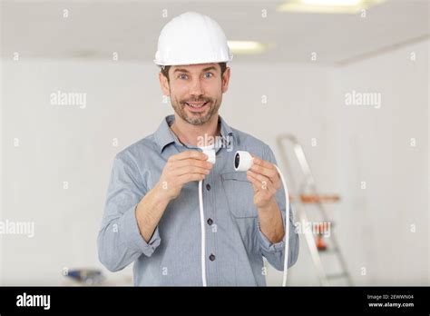 A Man Is Connecting Cables Stock Photo Alamy