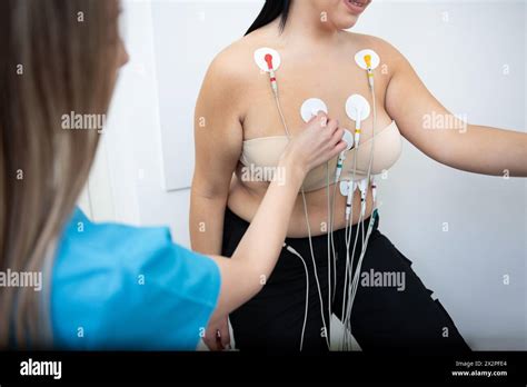 Obese Young Female Is Being Monitored By A Healthcare Professional