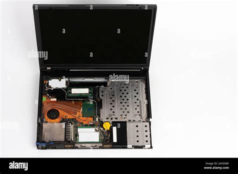 Old Laptop Removed Keyboard Hard Disk Drive Cd Drive And Battery On White Background