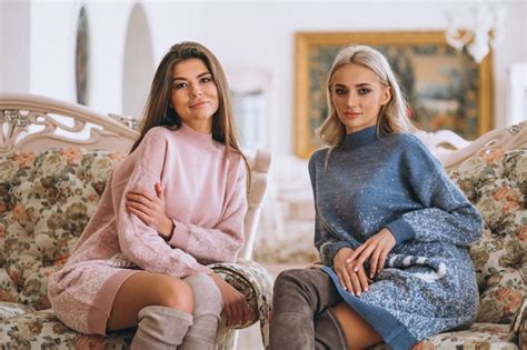 Free Photo Two Girls Sitting On Sofa And Chatting