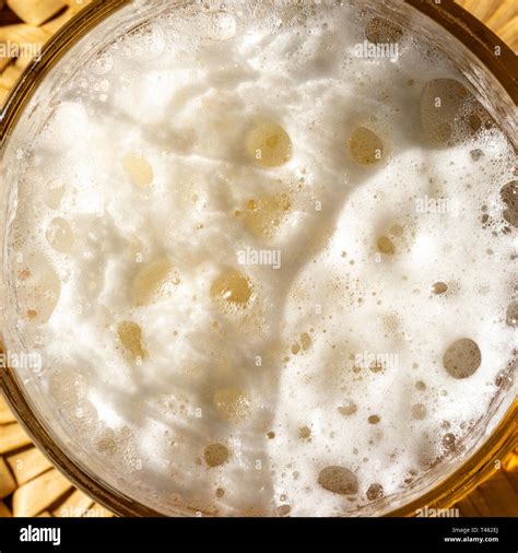 Beer In A Glass With Frothy Foam And Bubbles Beer Foam View From The