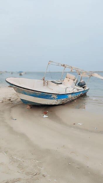 Premium Photo Idle Boat At Sea Side