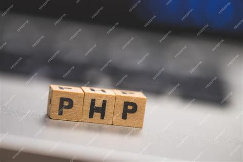 Premium Photo Php Programming Web Language Wooden Cubes With Letters Php Lying On A Laptop Concept