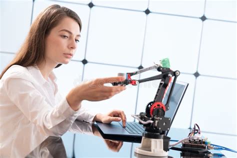 A Young Woman Writes An Algorithm For The Robot Arm Science Research