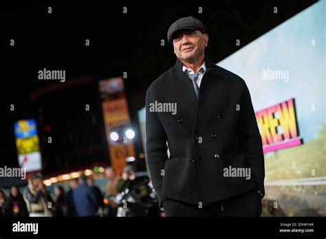Dave Bautista Poses For Photographers Upon Arrival At The Screening For