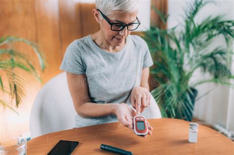 Measuring Glucose Levels And Using Smart Phone App To Follow Results Stock Image Image Of