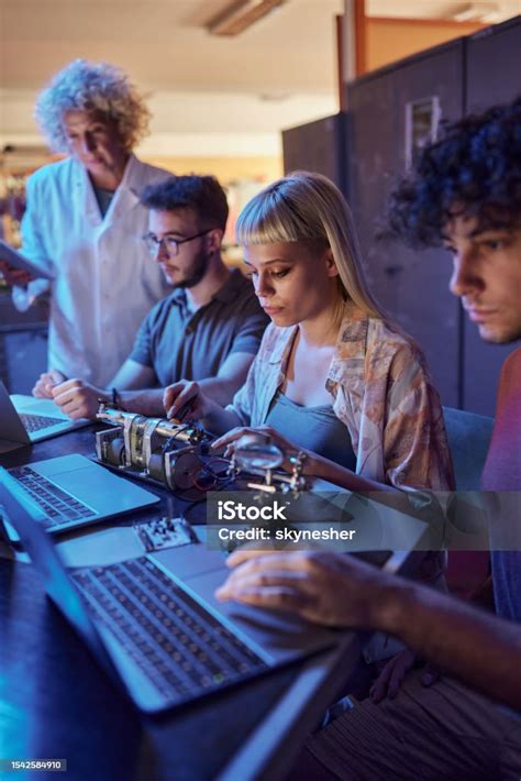 Young Programmers Using Computers During Robotics Class In Laboratory