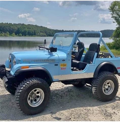 Blue Jeep Cj On Gravel Road