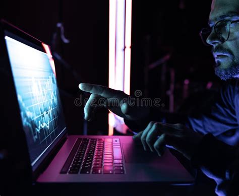 A Man Analyzing Stock Market Charts Financial Data On An Electronic Board Stock Image Image