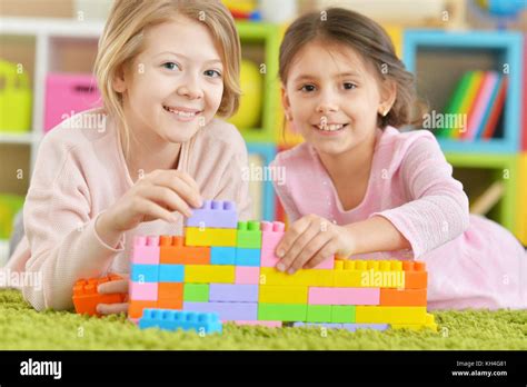 Girls Playing With Colorful Blocks Stock Photo Alamy