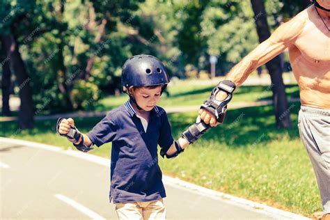 Premium Photo Little Boy Roller Skating In The Park
