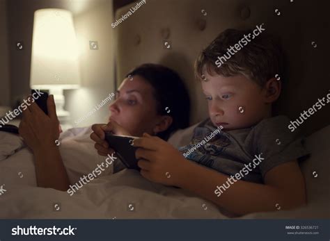 Mother Son Lying Bed Look Their Stock Photo Shutterstock