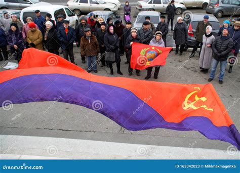Old Russian Soviet Flag Against The Backdrop Of The Political Gathering