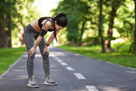 Taking Breath Exhausted Asian Jogger Girl Resting After Running In