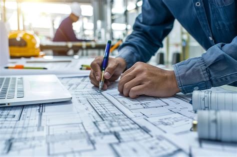 Group Of Industrial Engineers Working On Constructing Infrastructure In A Manufacturing Setting