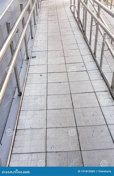 Close Up Entrance To The Building With A Wheelchair Ramp And Metal Handrails Outdoor Vertical