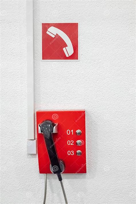 The Red Emergency Telephone In The Office Building Telephone System