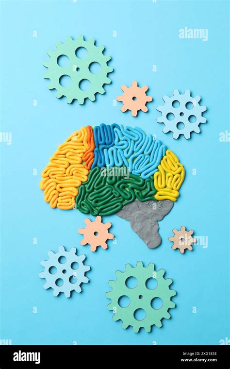 Amnesia Problem Brain With Sections Made Of Plasticine And Gears On Light Blue Background Flat