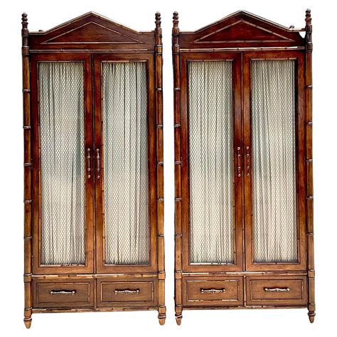Late 20th Century Vintage Regency Century Carved Bamboo Armoires A