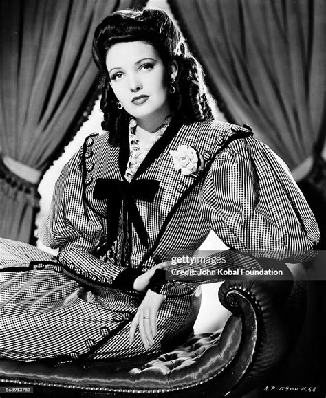 Portrait Of Actress Linda Darnell Wearing An Old Fashioned Dress With