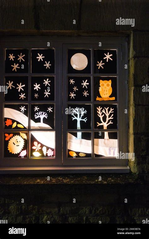 A House Window Split Into Sections With Christmas A Scenes In Each One Stock Photo Alamy