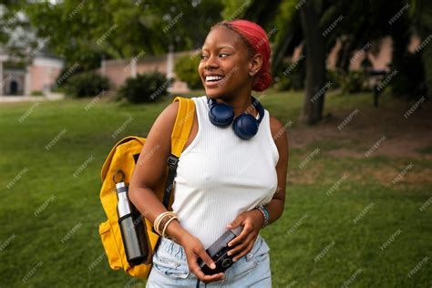 Premium Photo Portrait Of Braless Woman Outdoors With Backpack