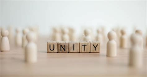 Word Unity Made Of Wooden Blocks And Small Playing Pins Stock Video Video Of Development