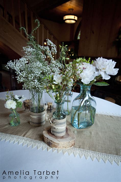 Vintage Bottles Tree Trunk Risers And Burlap Wrapped Vases For