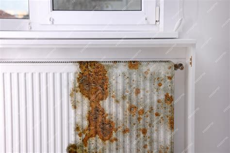 Premium Photo Modern Panel Radiator Affected By Rust Indoors