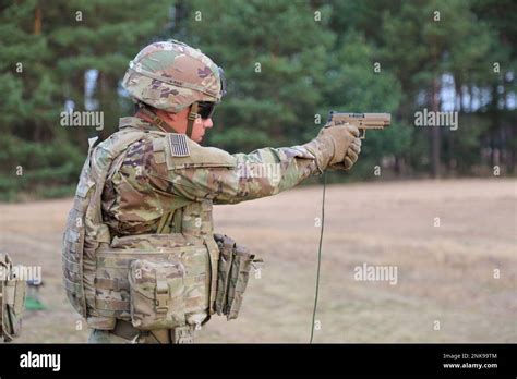 U S Army Soldier Assigned To The 3rd Armored Brigade Combat Team Test Fires An M17 Pistol